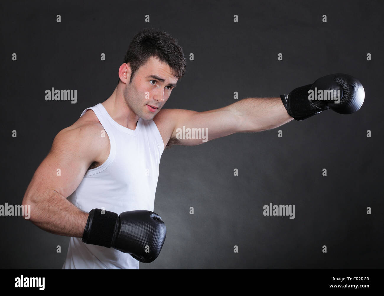 Portrait sportsman boxer in studio against dark background Stock Photo ...