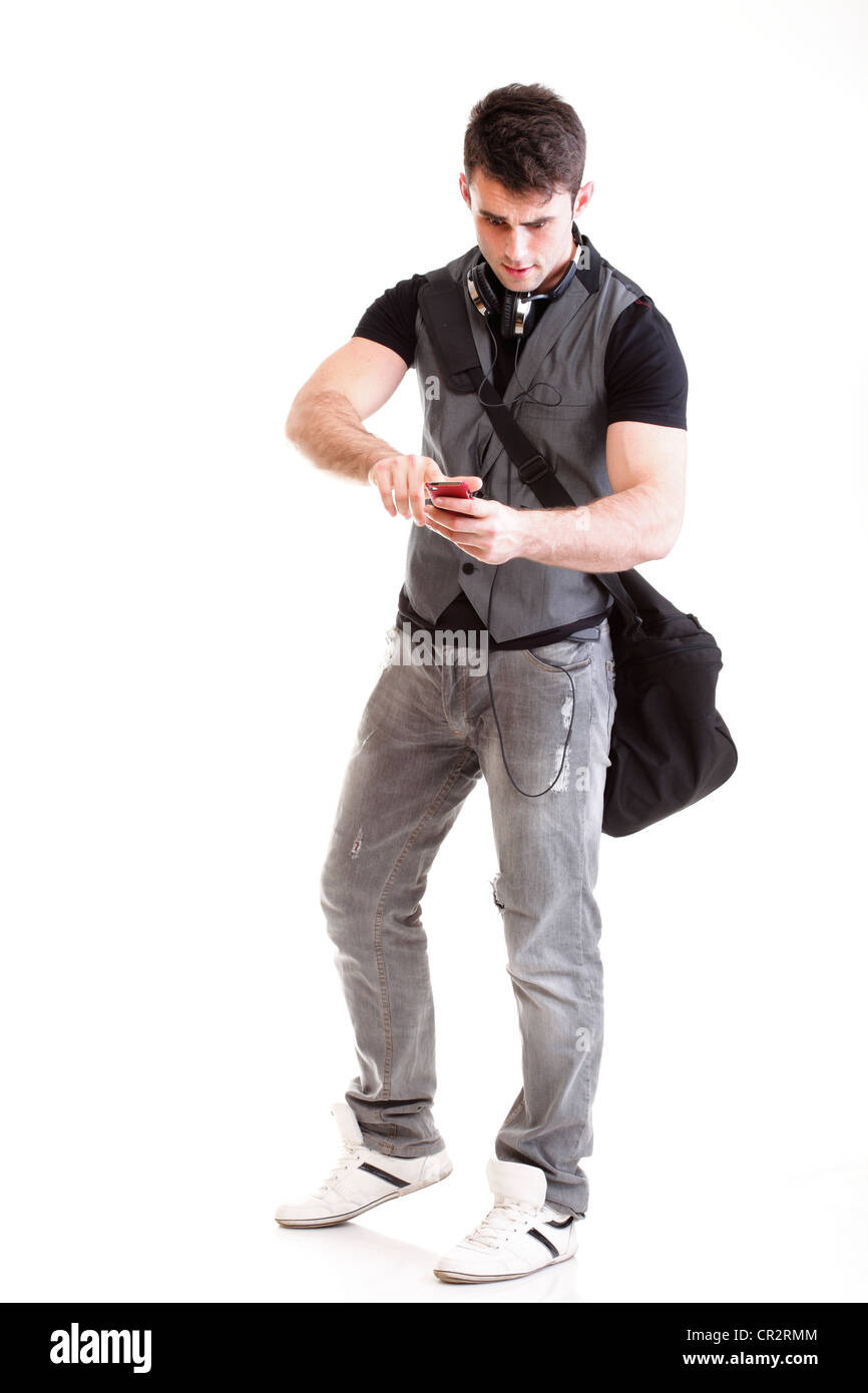 Full length portrait school boy with phone isolated on white. Music or ...