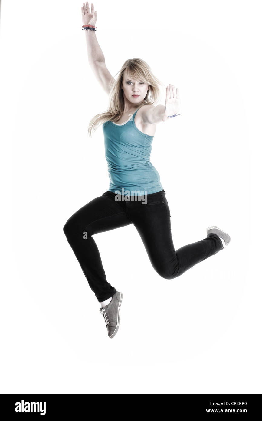 Happy woman jumping with arms up in full length isolated on white ...