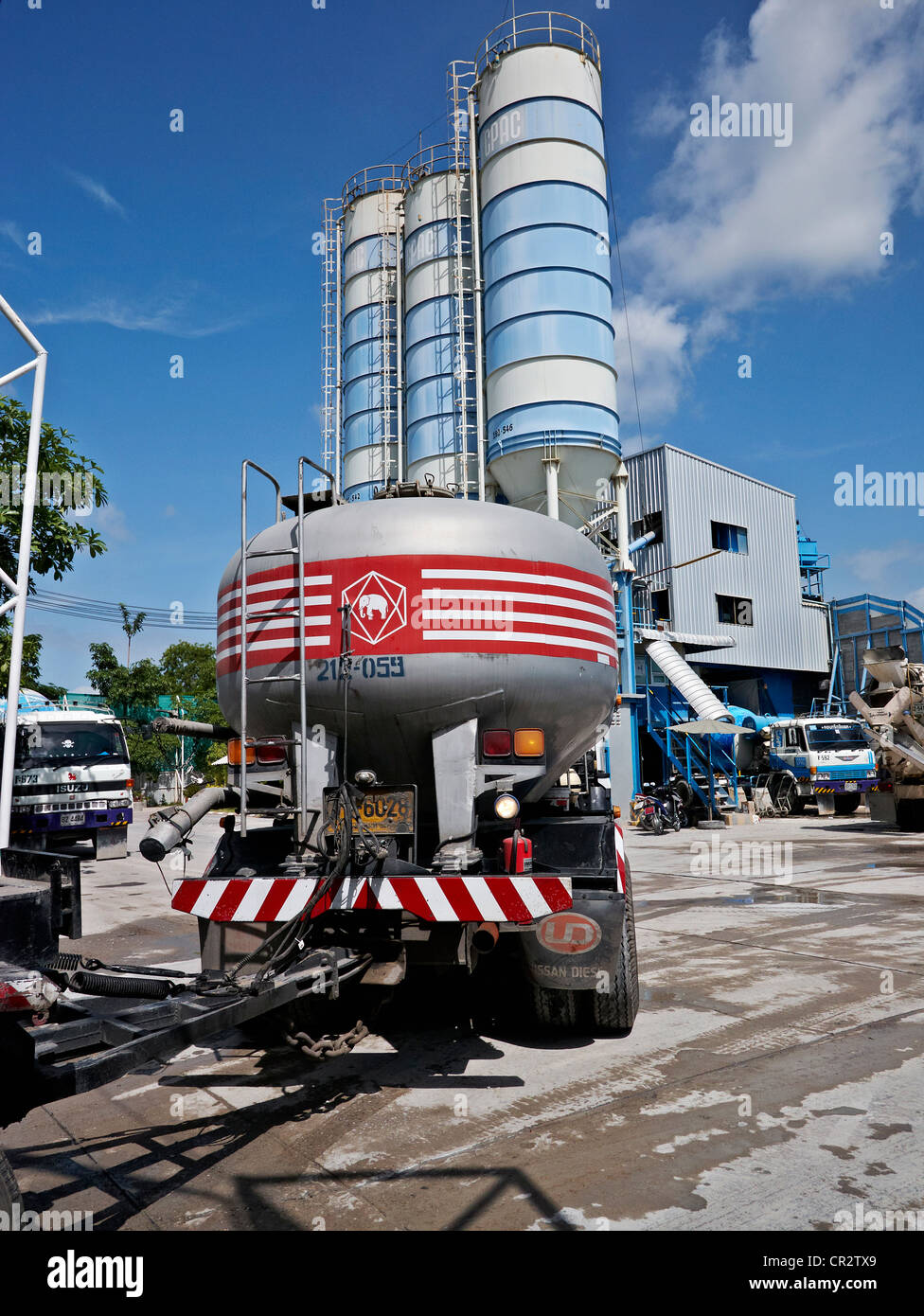 Cement plant with delivery trucks in Thailand Stock Photo - Alamy