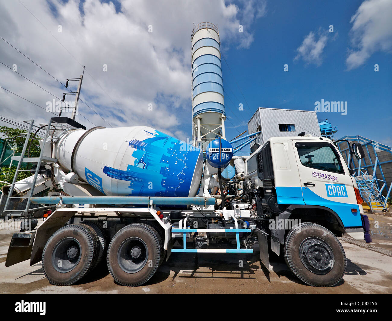 Truck loading at a cement plant in Thailand Stock Photo - Alamy