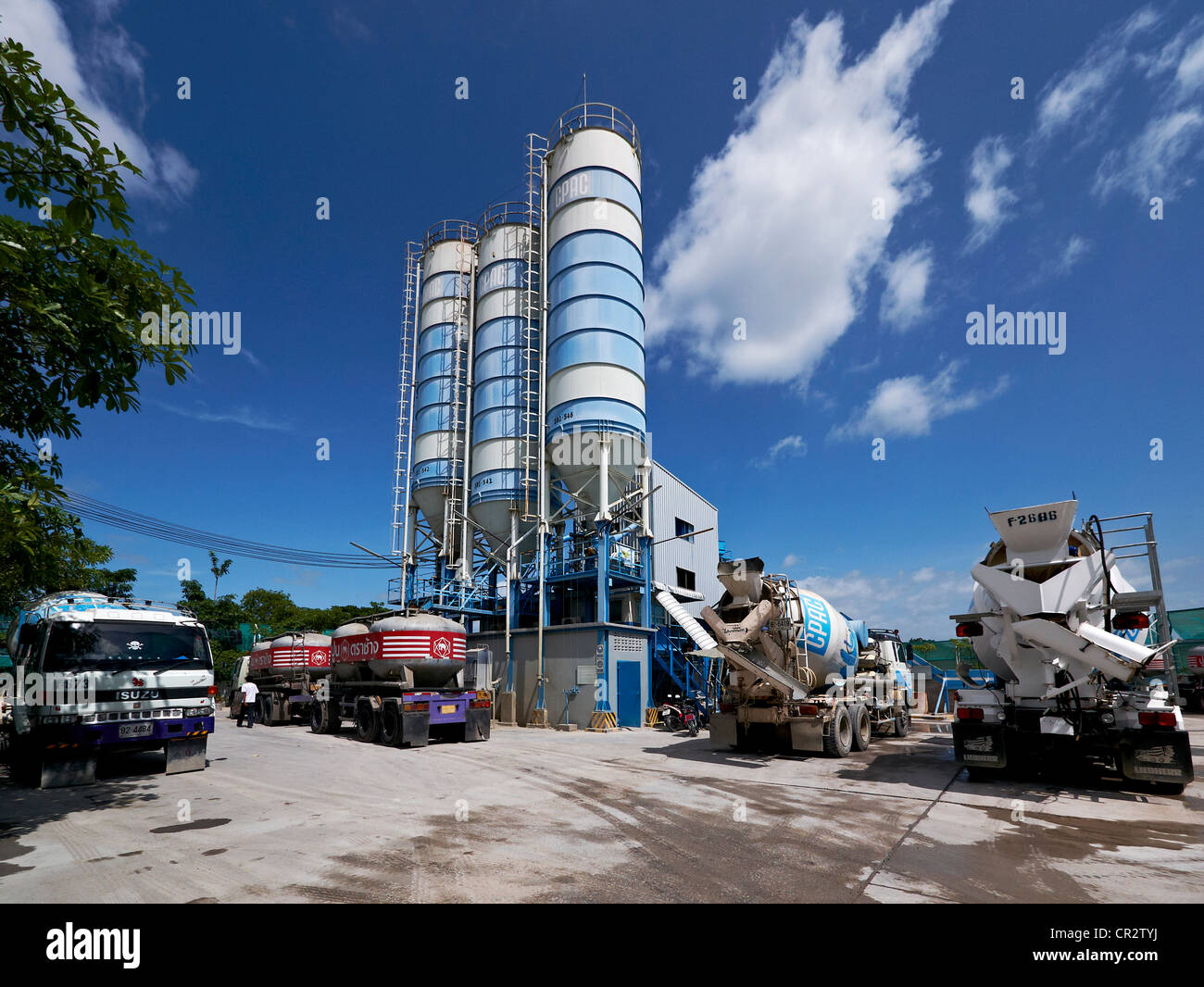 Cement plant with delivery trucks in Thailand Stock Photo - Alamy