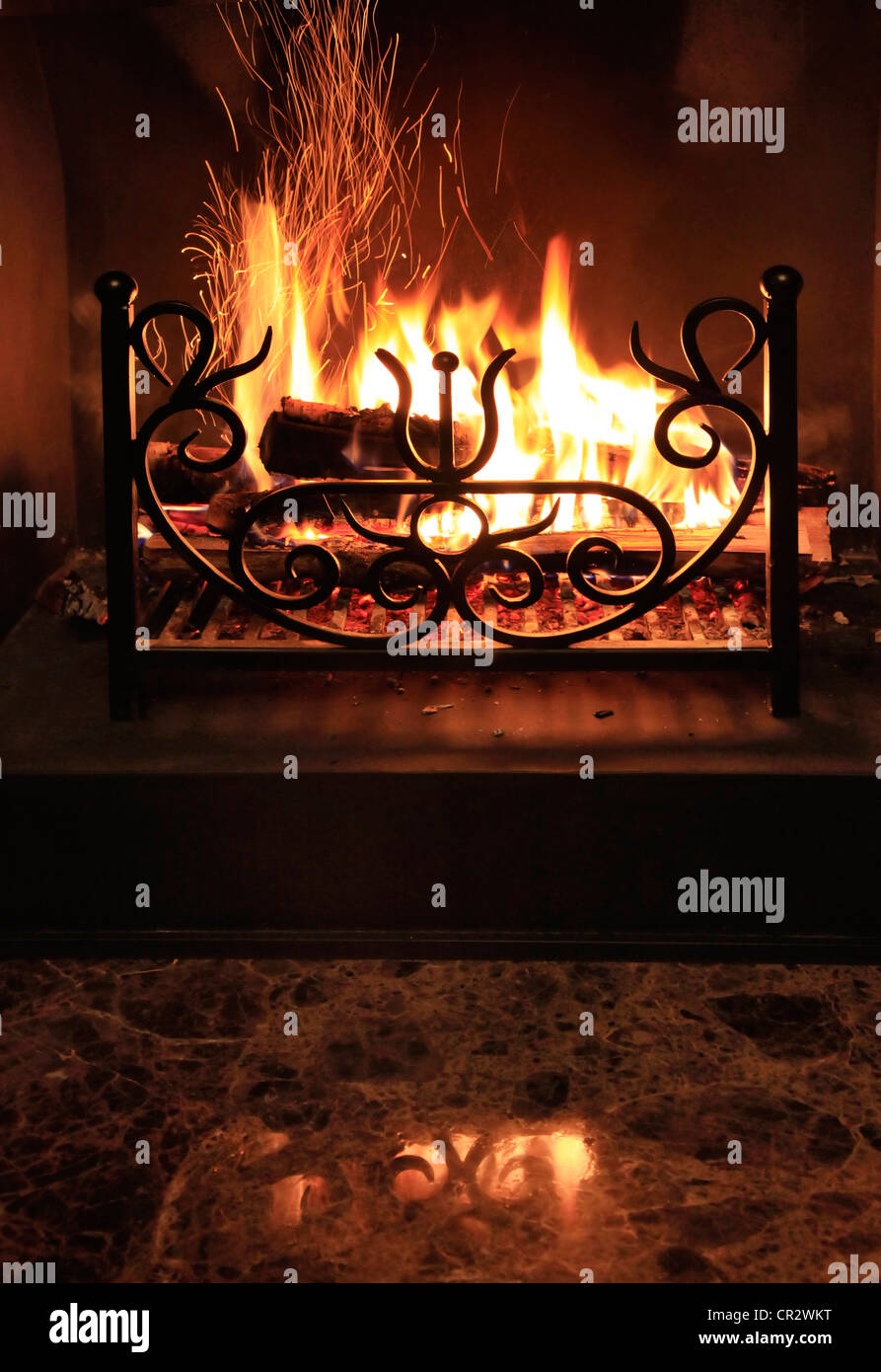 Fire with sparks in a beautiful fireplace Stock Photo - Alamy