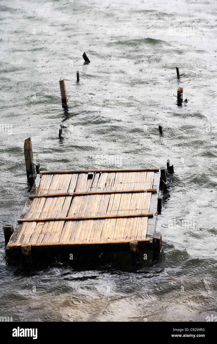 The wooden destroyed bridge in a rain Stock Photo - Alamy