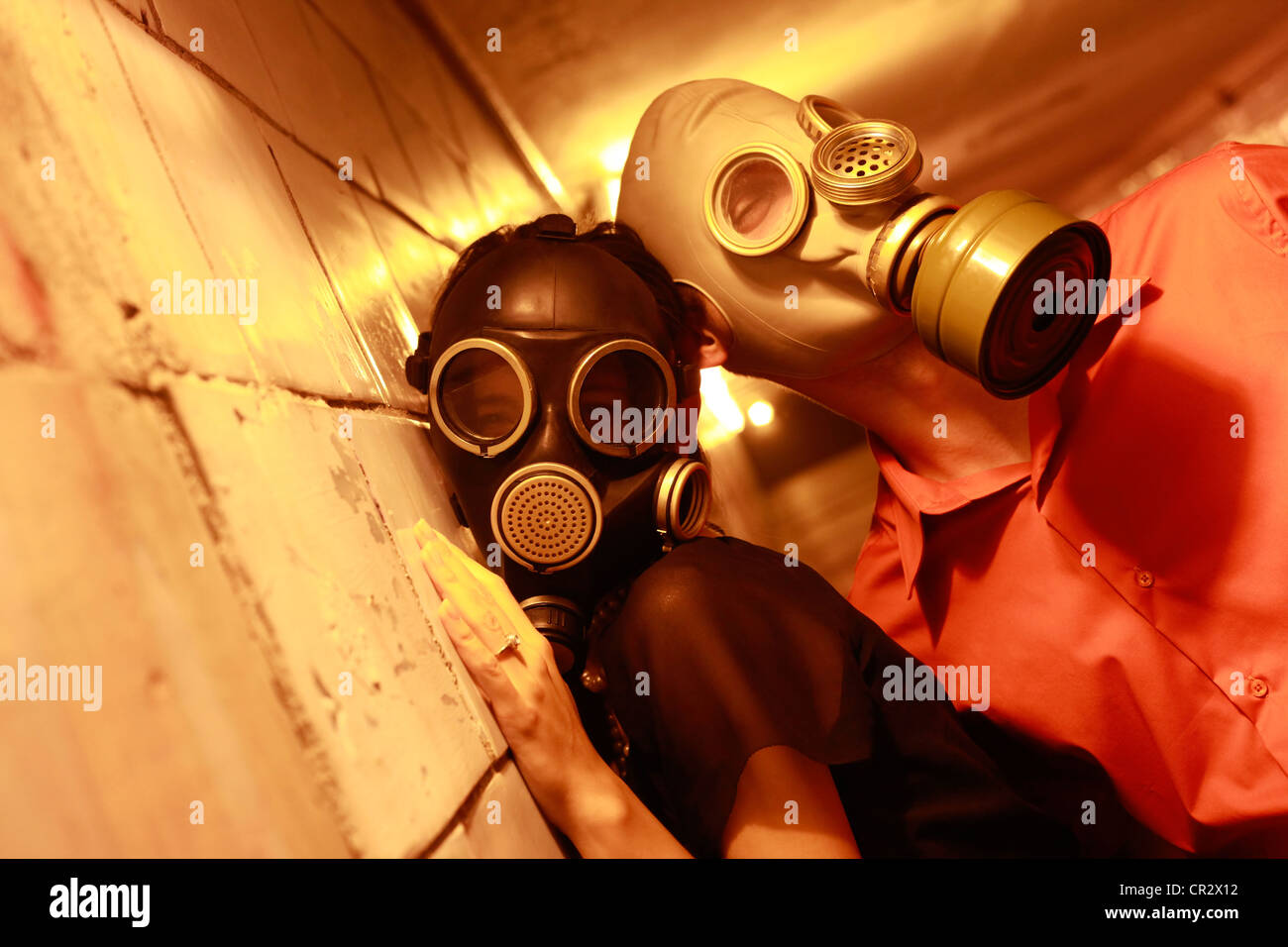 Married couple in gas masks in a tunnel Stock Photo - Alamy