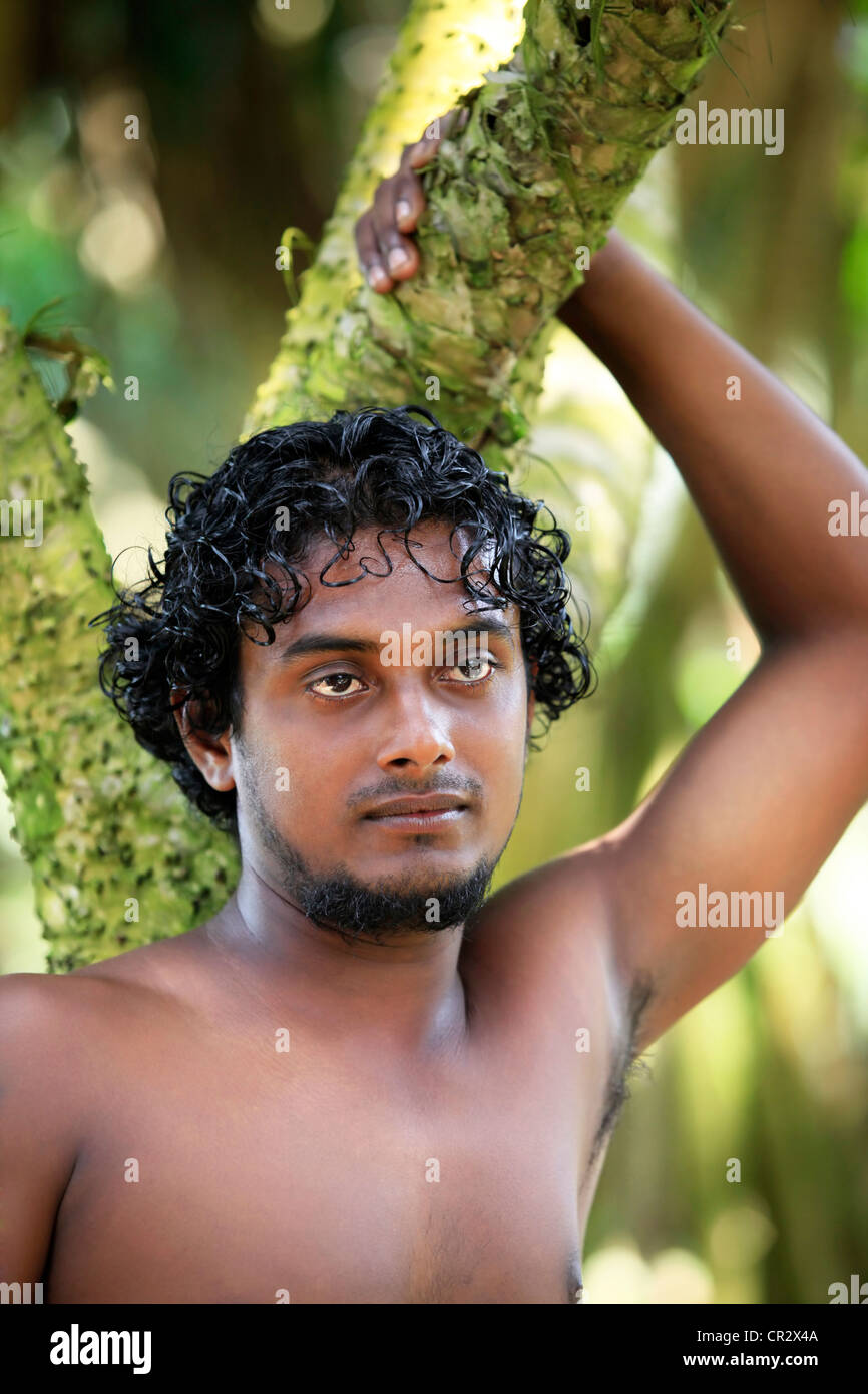 Portrait young men on a green background. Sri Lanka Stock Photo - Alamy