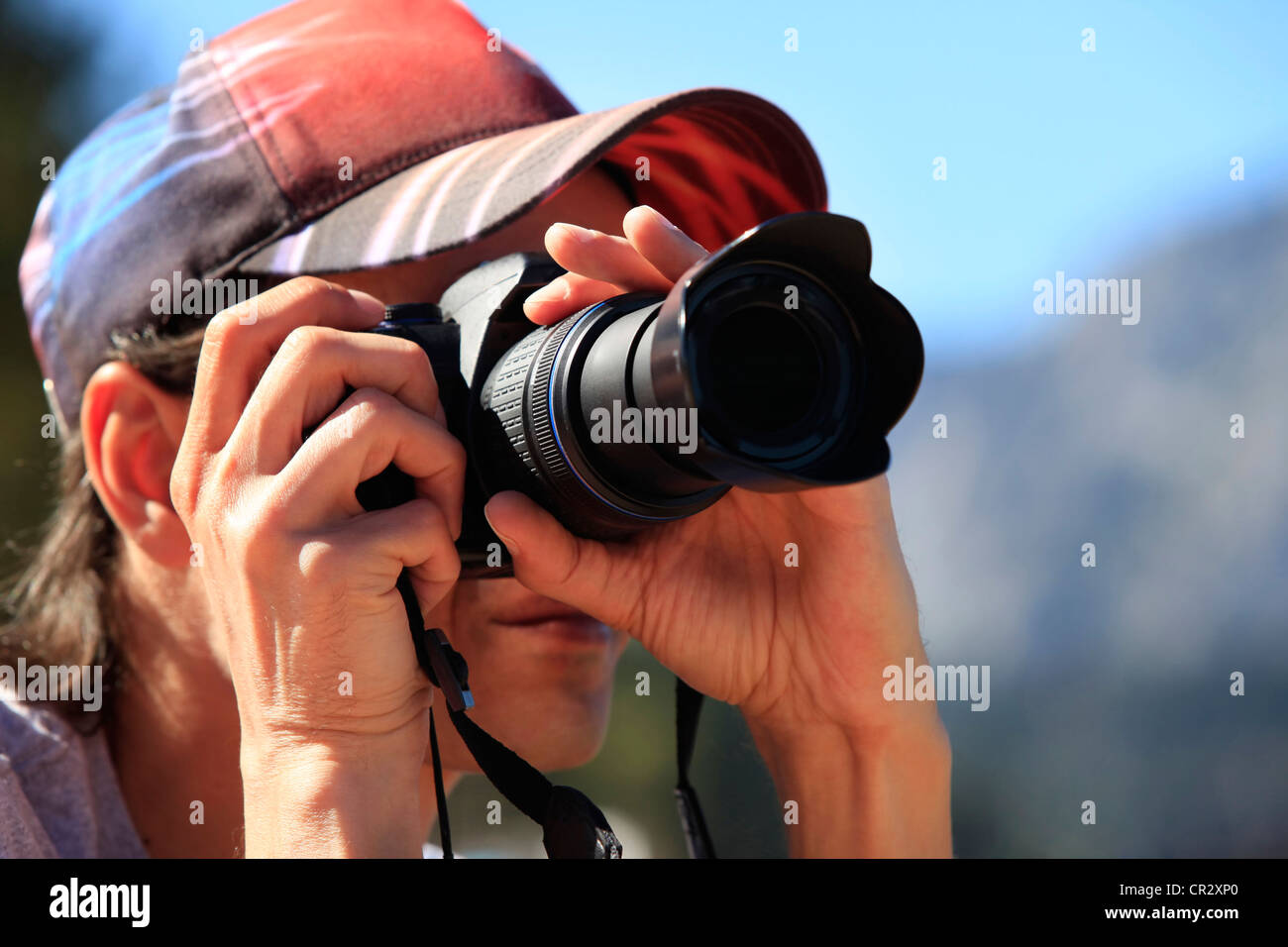 Man with photo camera taking pictures Stock Photo - Alamy