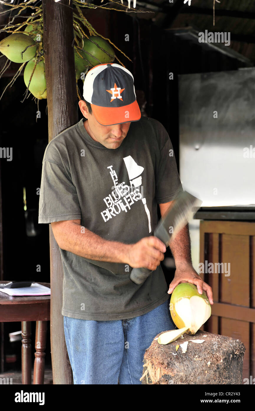 Man preparing a coconut hi-res stock photography and images - Alamy