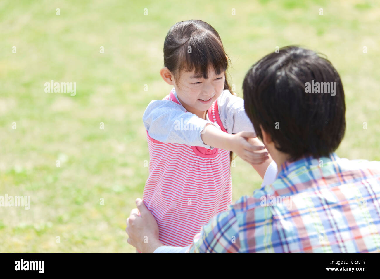 Daughter Reaching For Father Stock Photo - Alamy