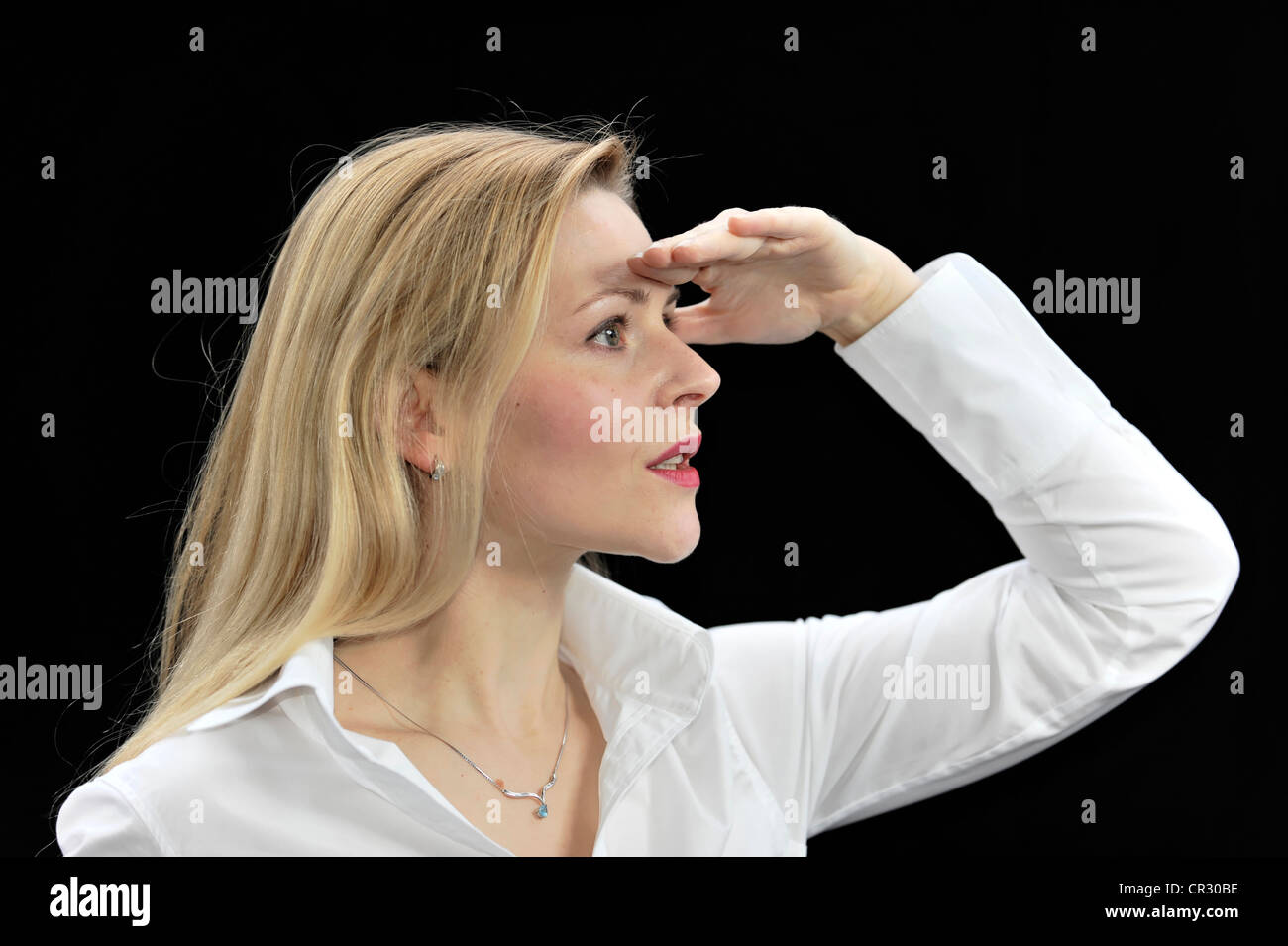 Young blonde woman looks distance hi-res stock photography and images ...