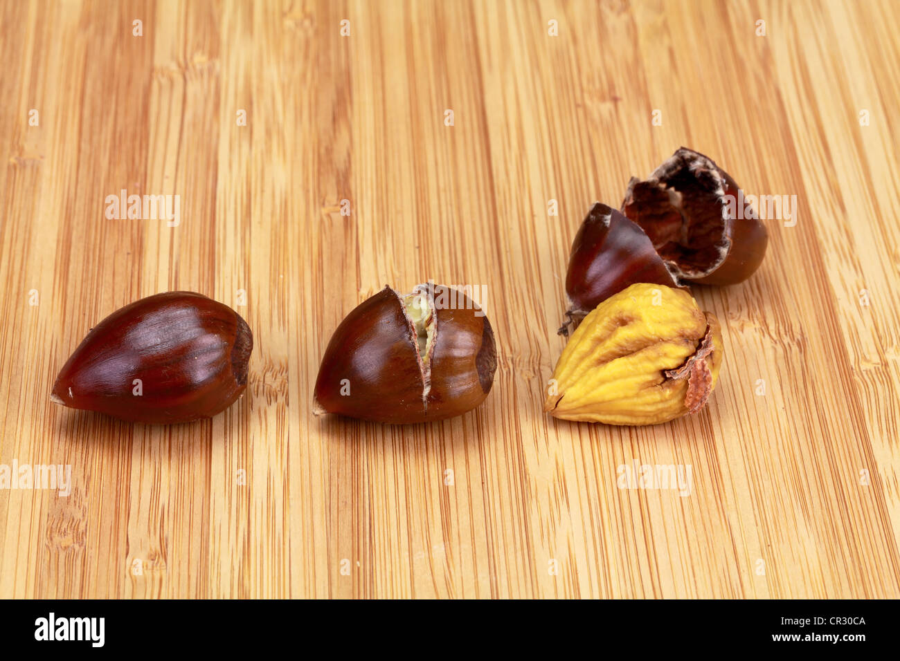 Chestnut an evolution Raw cooked and peeled chestnut with husk Stock ...