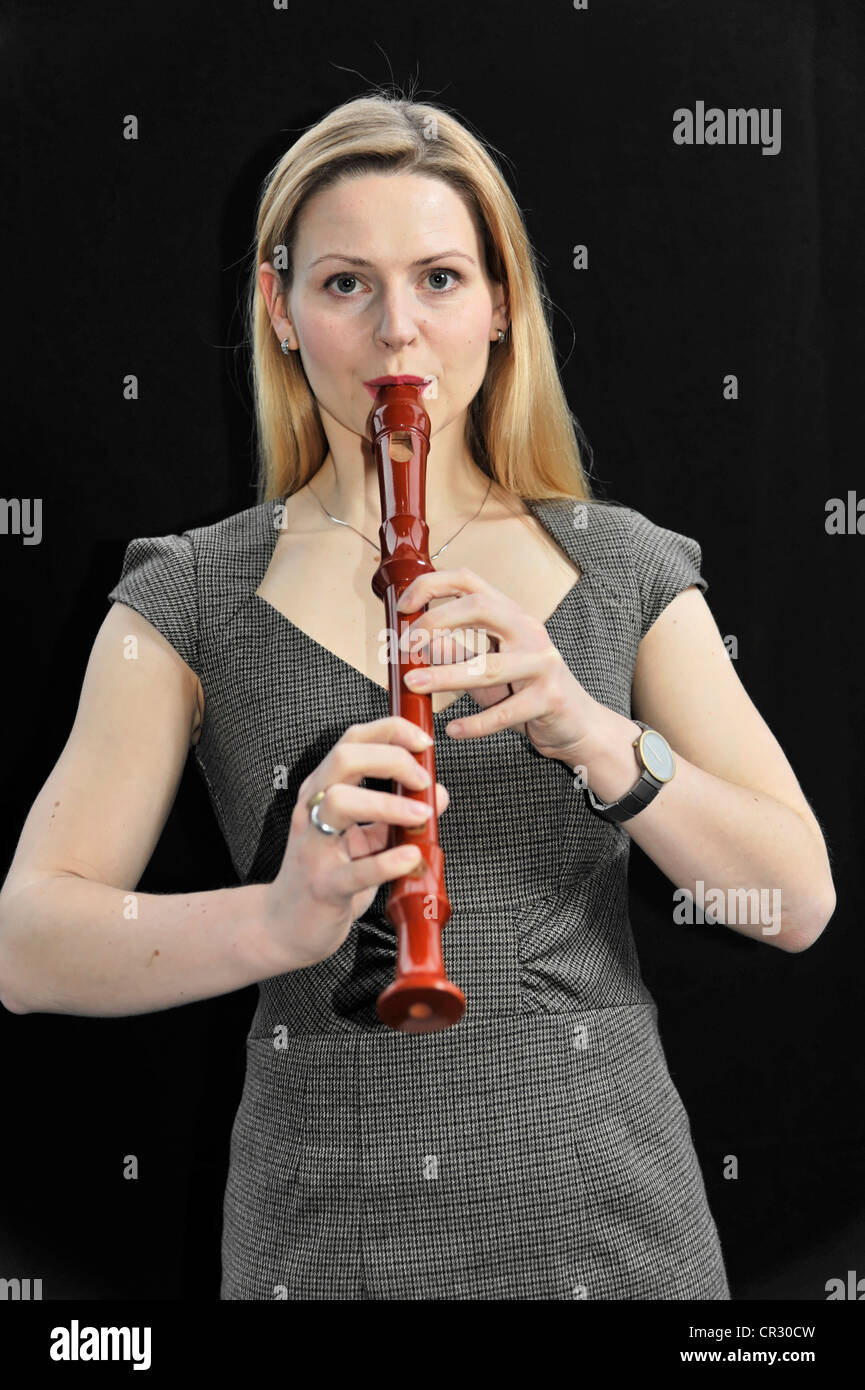 Young woman playing the alto recorder Stock Photo - Alamy