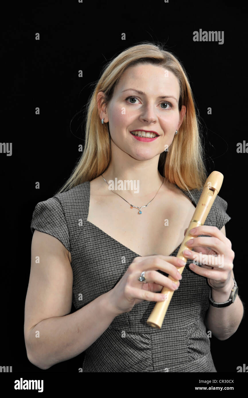 Young woman playing recorder hi-res stock photography and images - Alamy
