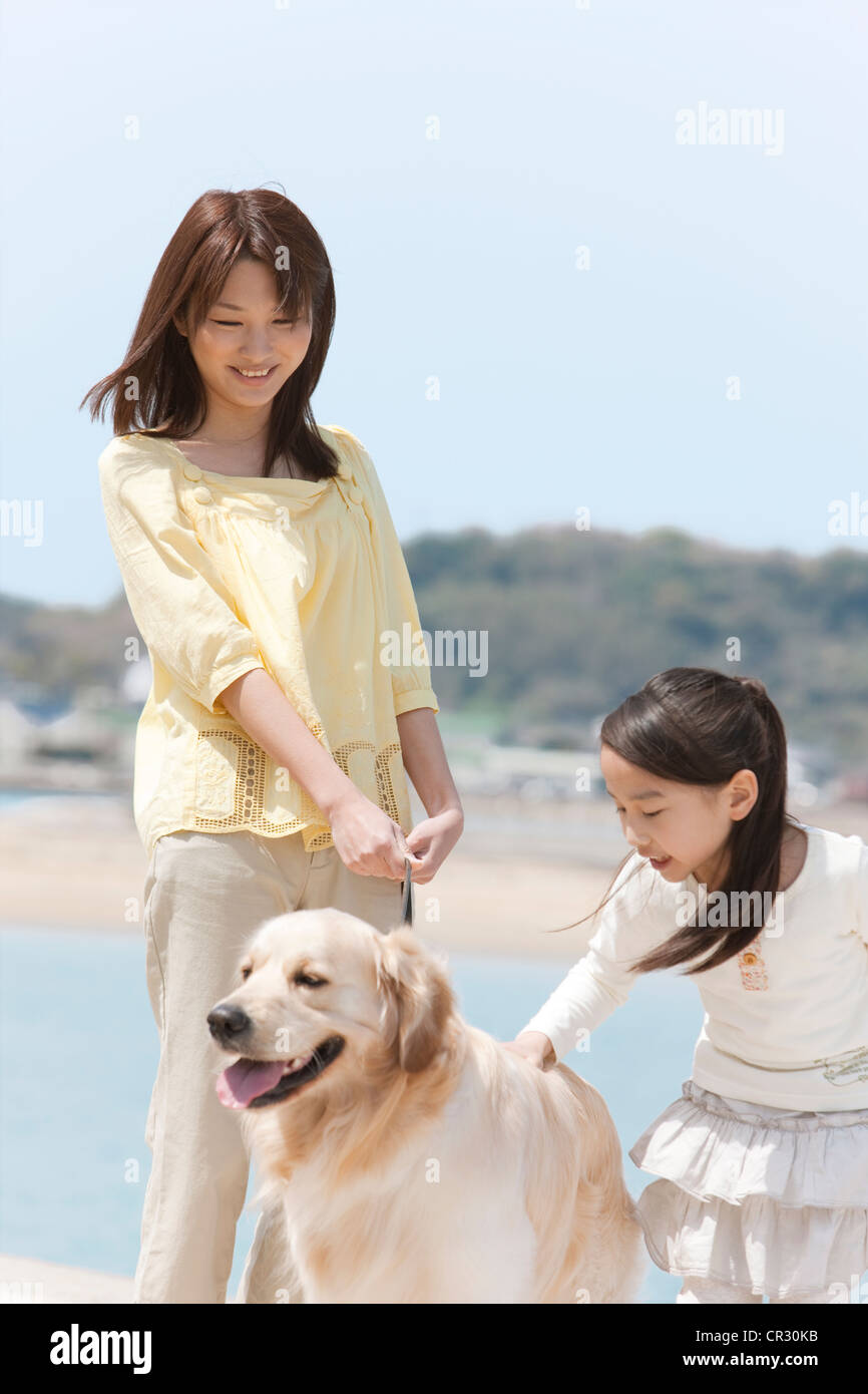 Mother, Daughter and Dog Stock Photo - Alamy