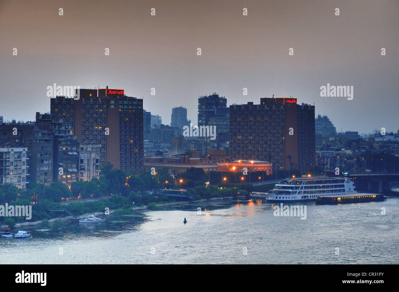 A central Cairo panorama looking west across the Nile River at dusk ...