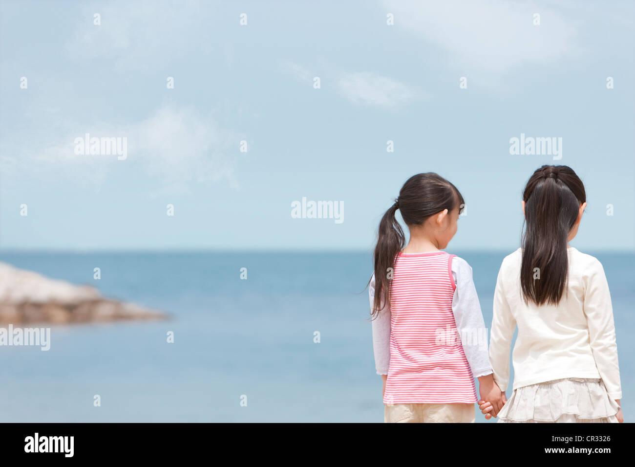 Two girls at the seashore hi-res stock photography and images - Alamy