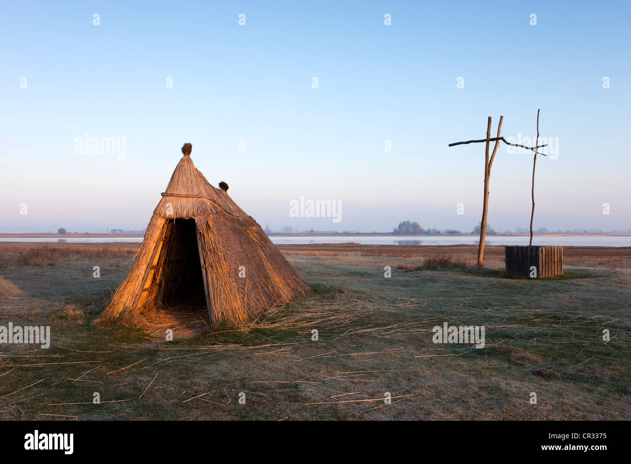 Draw well and a reed hut in the Lake Neusiedl National Park, Seewinkel ...