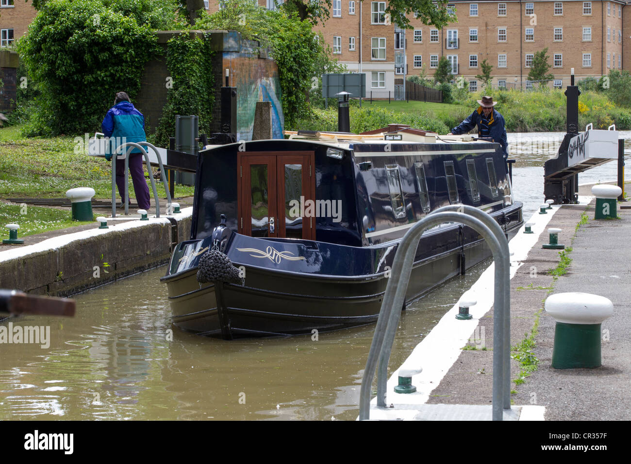 Narrow boat going through locks on the river nene by the ...
