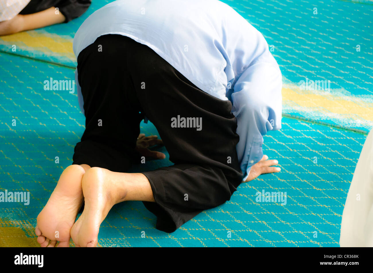 Muslim at prayer, Kuala Lumpur, Malaysia, Southeast Asia Stock Photo ...