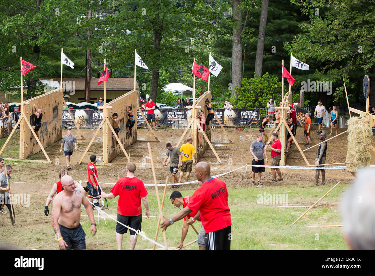 Participants of challenging sprint obstacle trail race, Spartan Race in ...