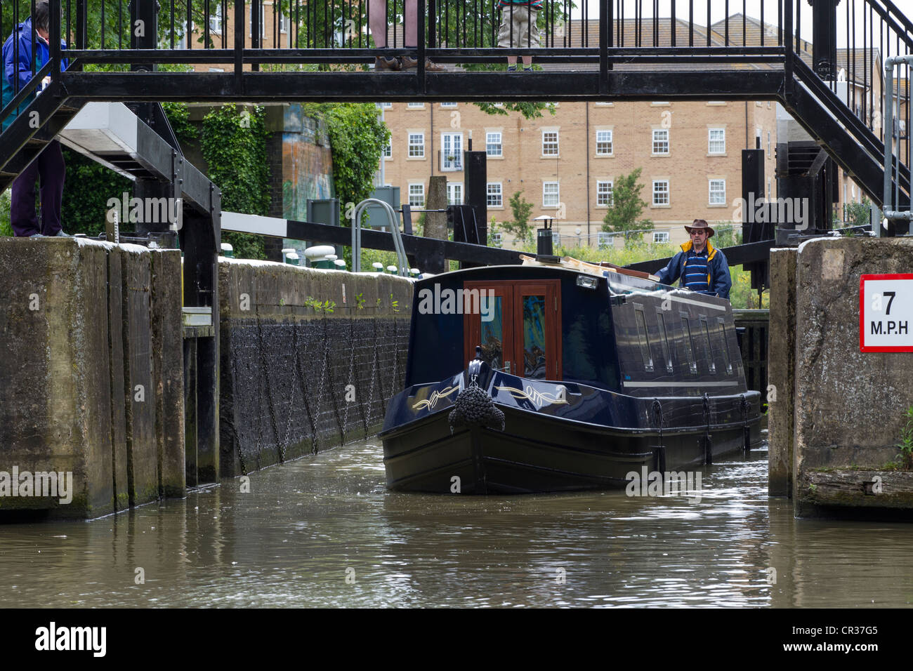 Narrow boat going through locks on the river nene by the ...