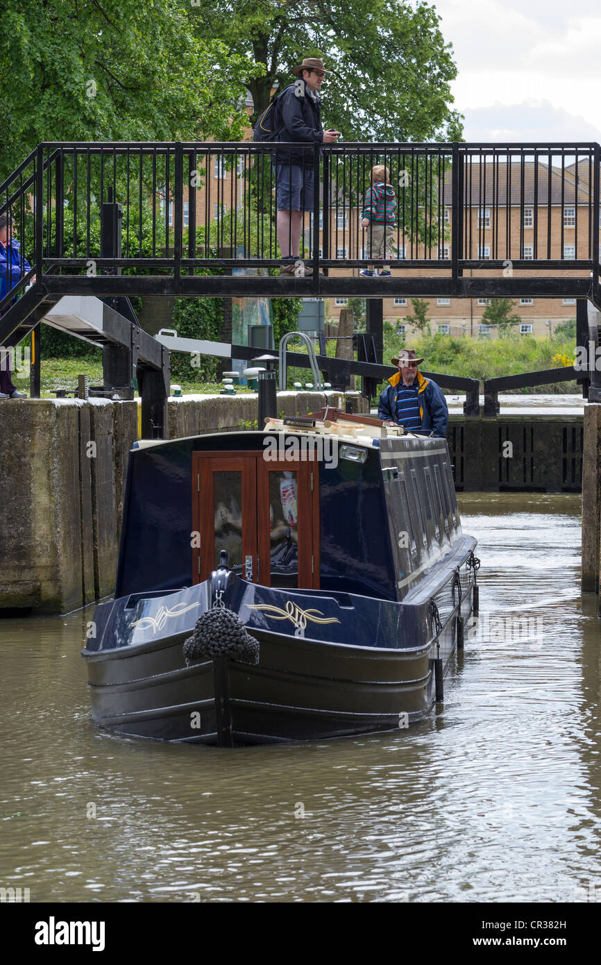 Narrow boat going through locks on the river nene by the ...