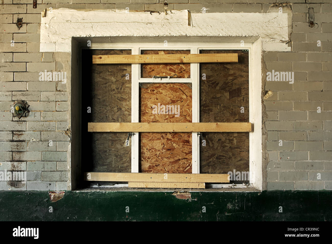 Boarded up old window in a derelict building Stock Photo - Alamy