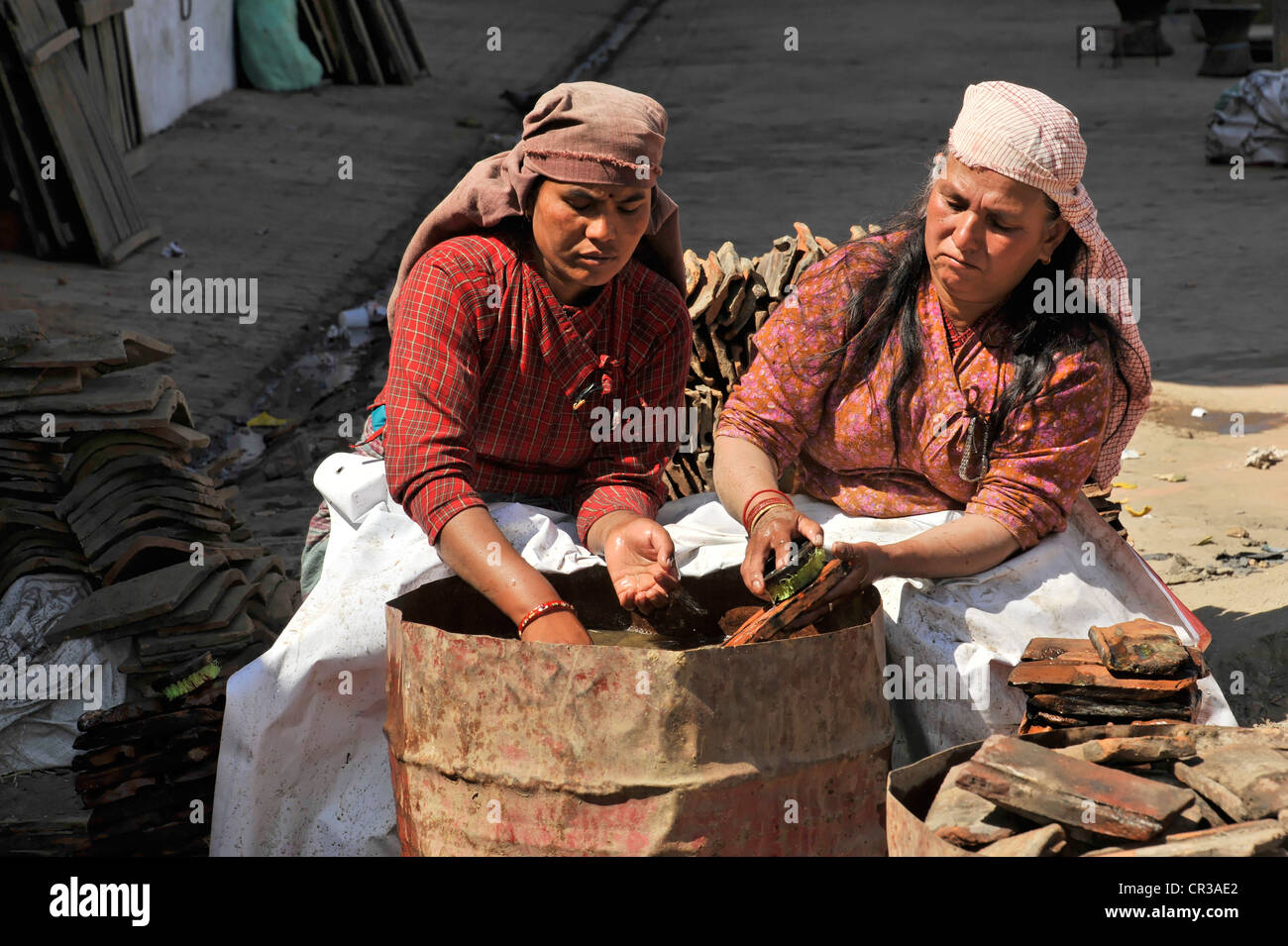 Nepal kathmandu woman washing clothes hi-res stock photography and ...