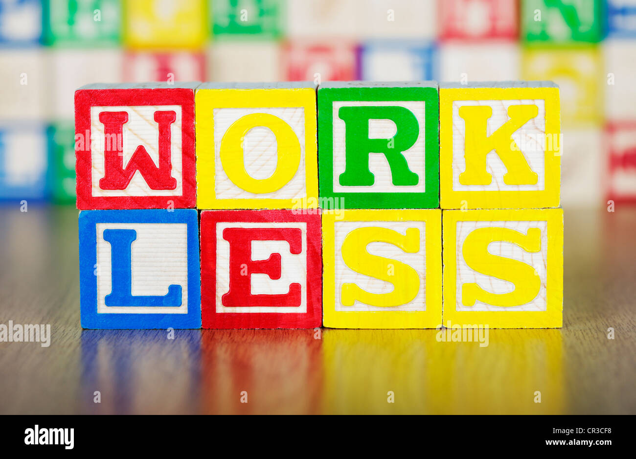 Work Less Spelled Out in Alphabet Building Blocks Stock Photo - Alamy