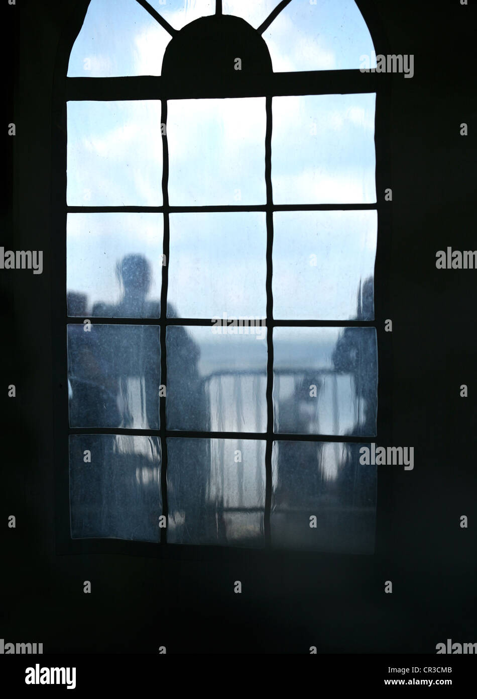 Silhouettes of people behind of a window Stock Photo - Alamy