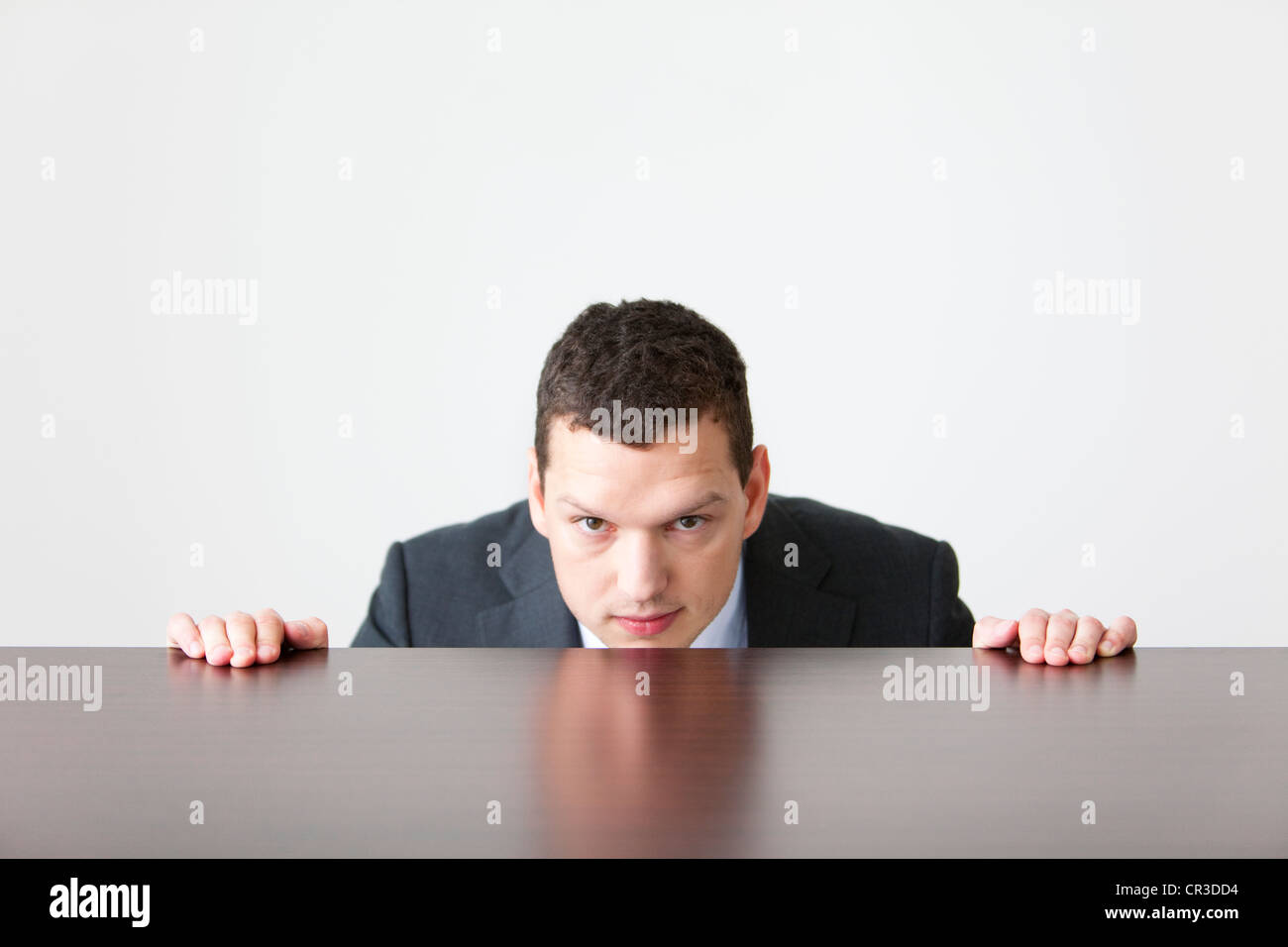 Businessman Behind Desk Stock Photo - Alamy