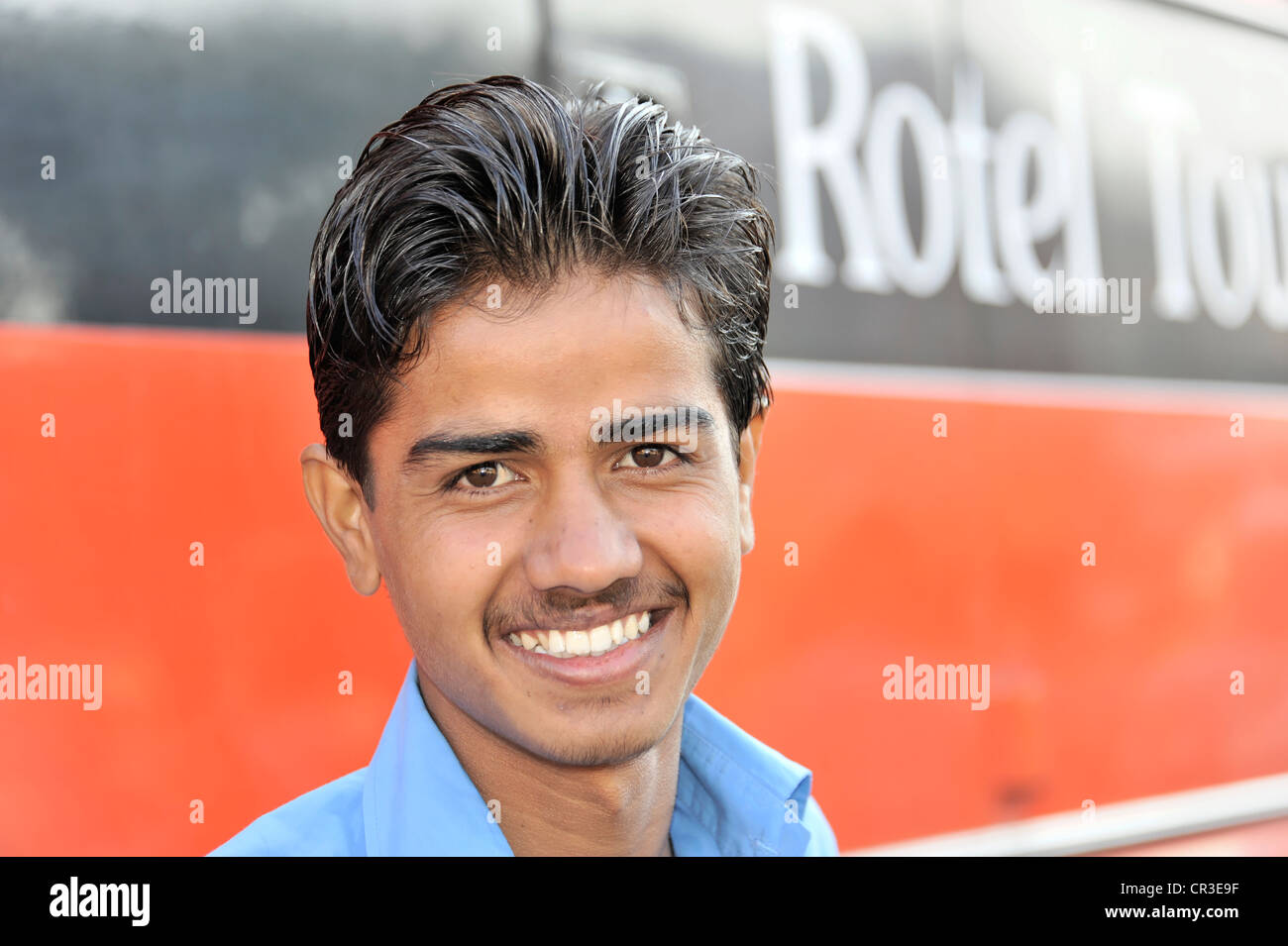 Young Indian man, at a Rotel bus, Rotel mobile hotel, Jaipur, Rajasthan ...