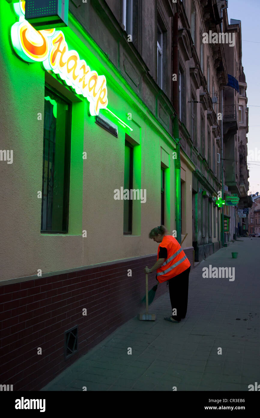 A female street sweeper in the morning, Lviv, Ukraine Stock Photo - Alamy