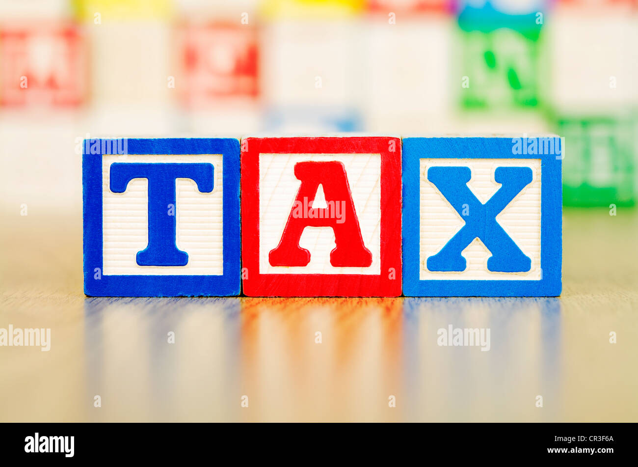 TAX Spelled Out in Alphabet Building Blocks Stock Photo - Alamy