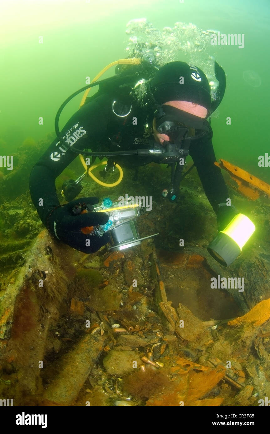 Scuba diver with ammunition, cartridges, bullets, in the underwater ...