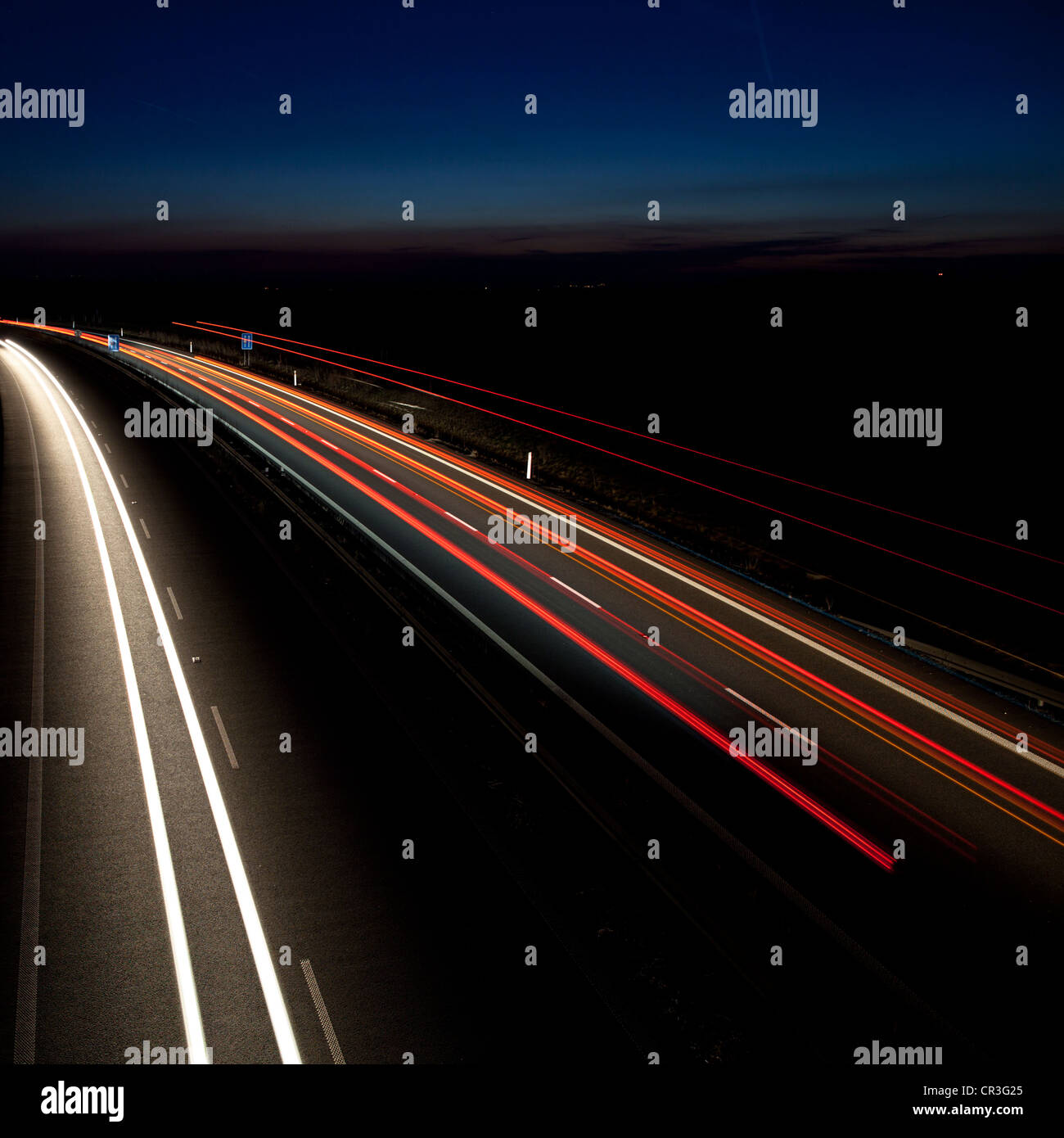 Cars moving fast on a highway Stock Photo - Alamy