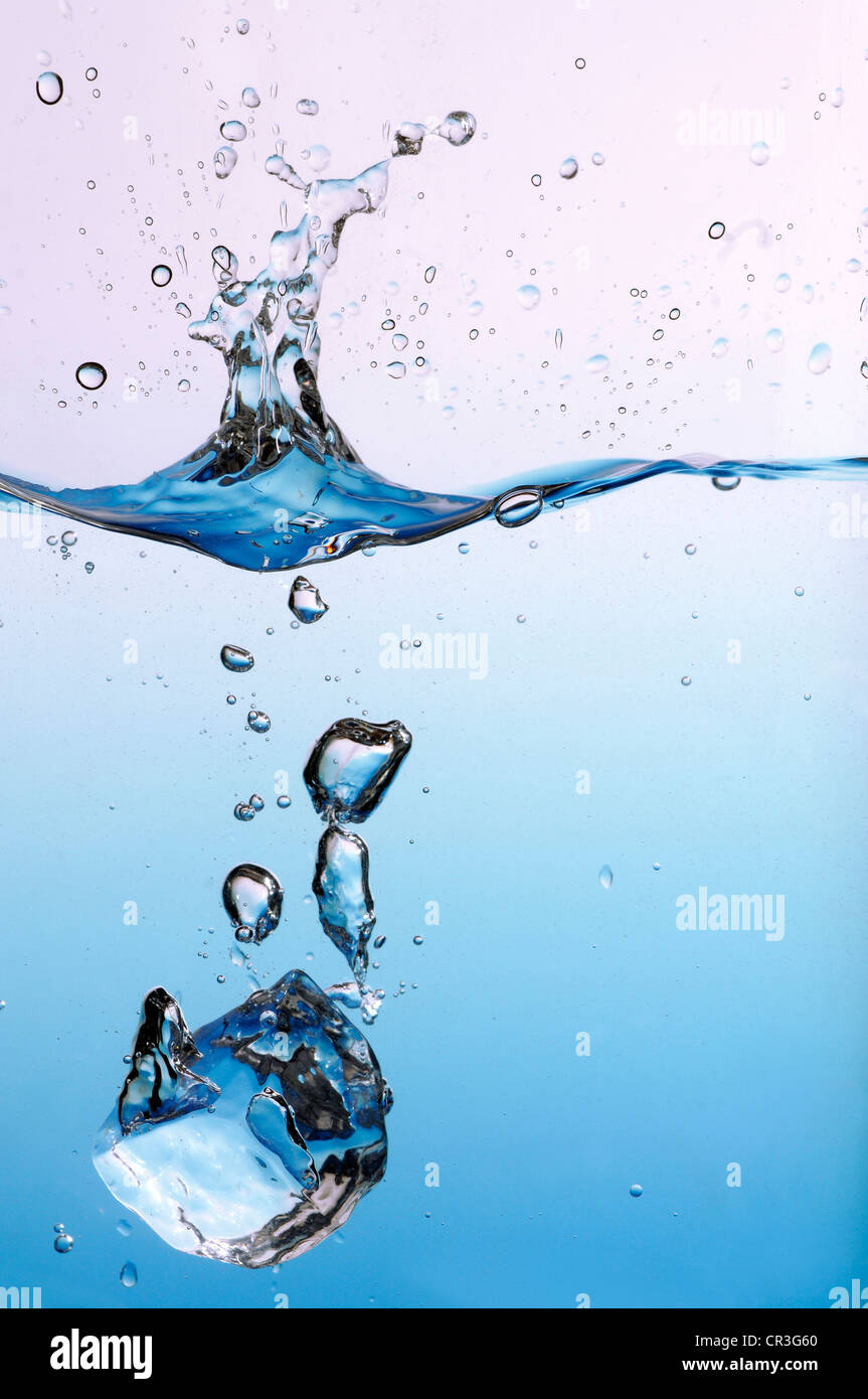 ice cube splashing in the water Stock Photo - Alamy