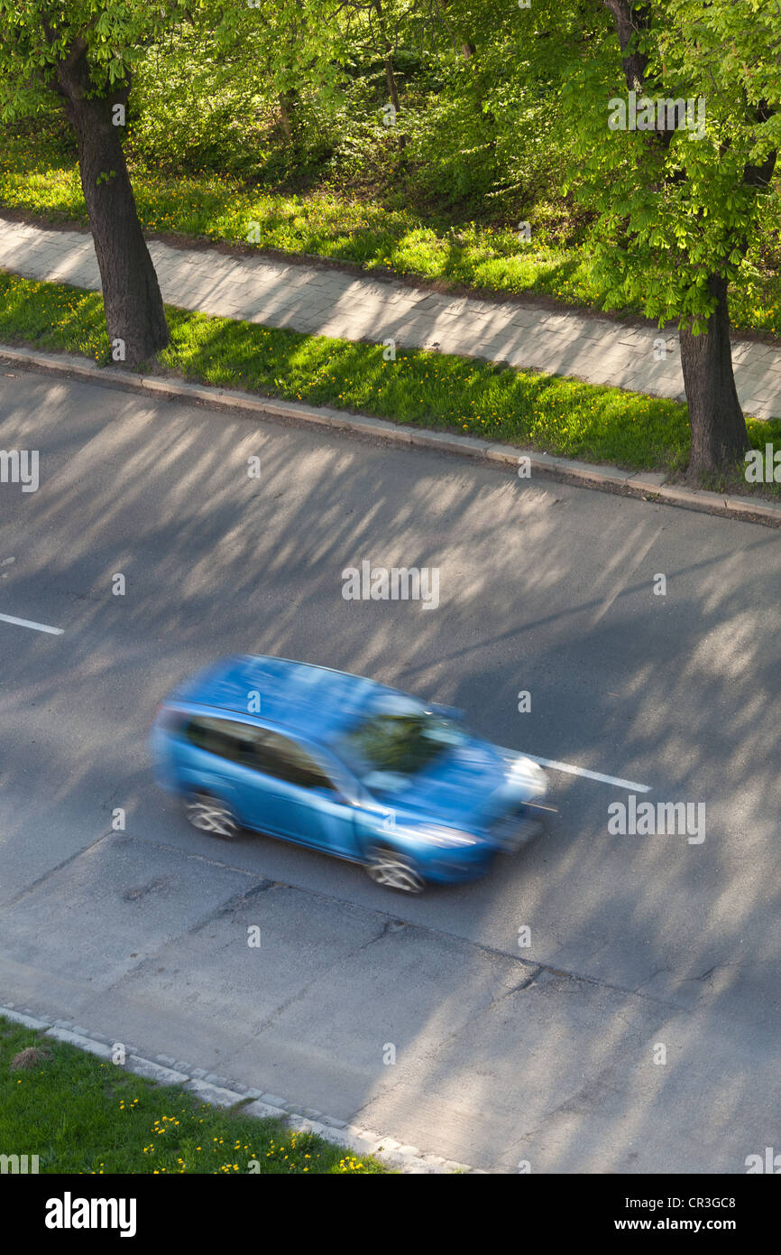 Speeding concept - Cars moving fast on a road on a lovely sunny day ...