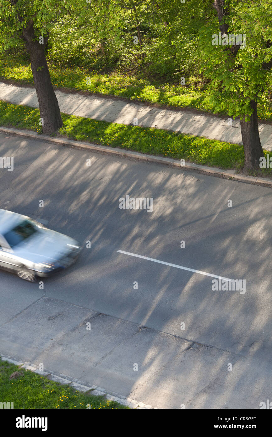 Speeding concept - Cars moving fast on a road on a lovely sunny day ...