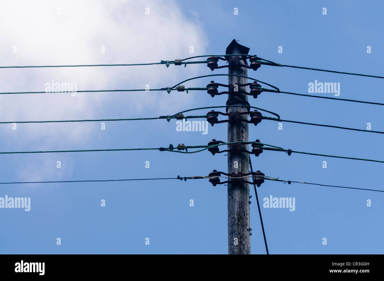 Overhead electricity power lines on a wooden pole Stock Photo - Alamy