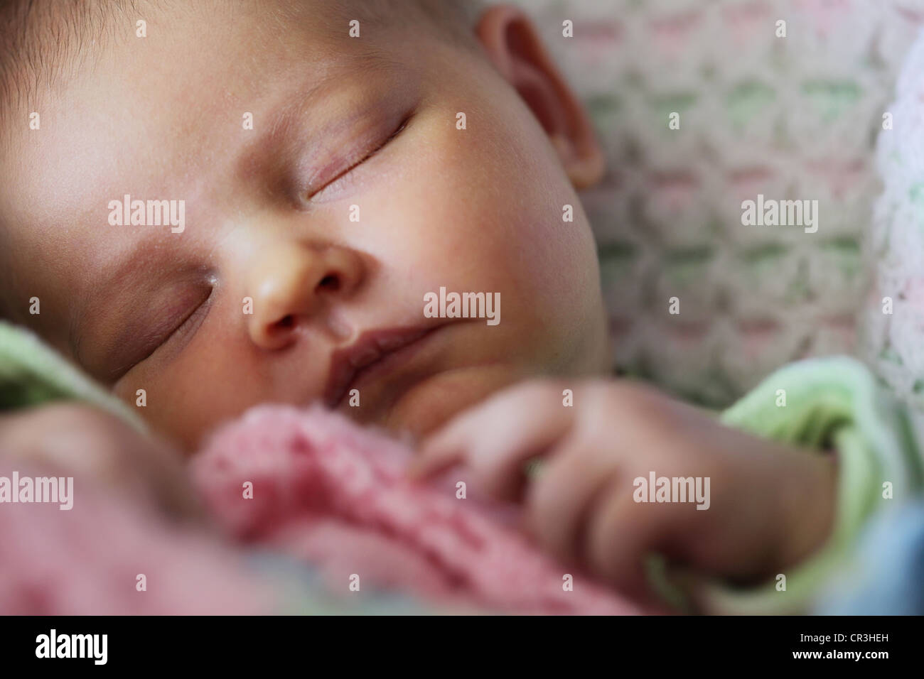 A newborn baby girl sleeping / dreaming Stock Photo - Alamy