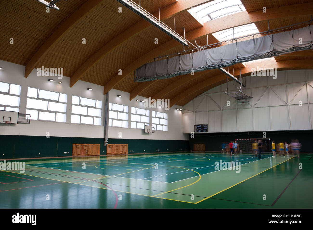 modern multifunctional gymnasium with young people getting ready for ...