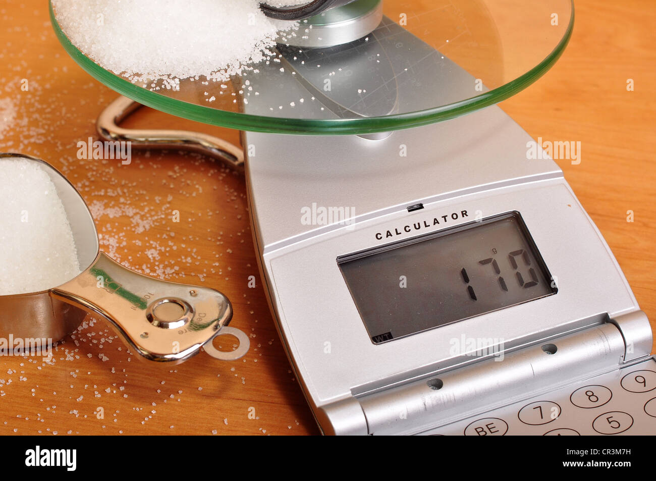 Photo of weighing sugar on scale Stock Photo - Alamy Photo of weighing sugar on scale Stock Photo - Alamy