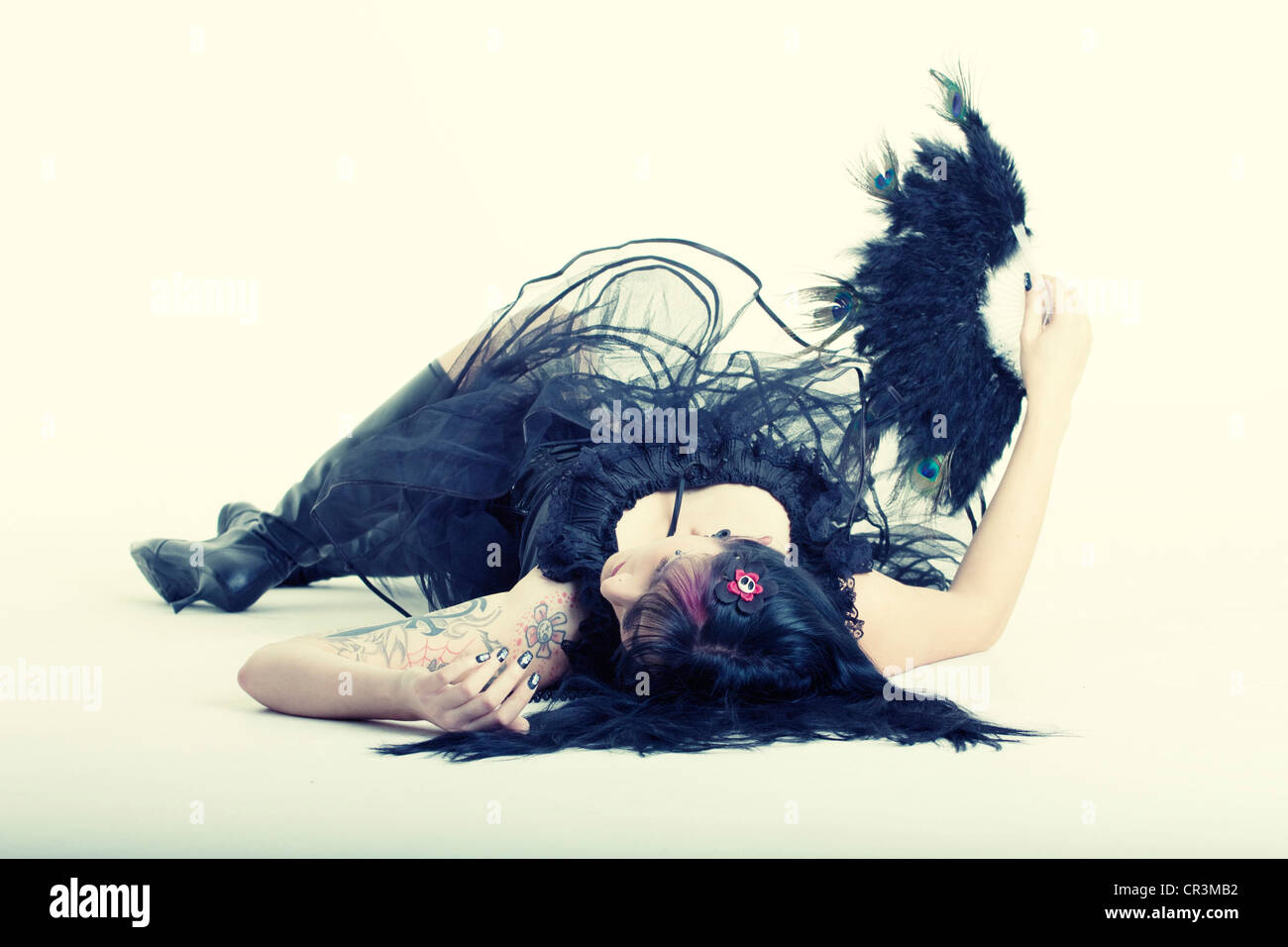 Woman lying on the floor, Gothic Stock Photo - Alamy