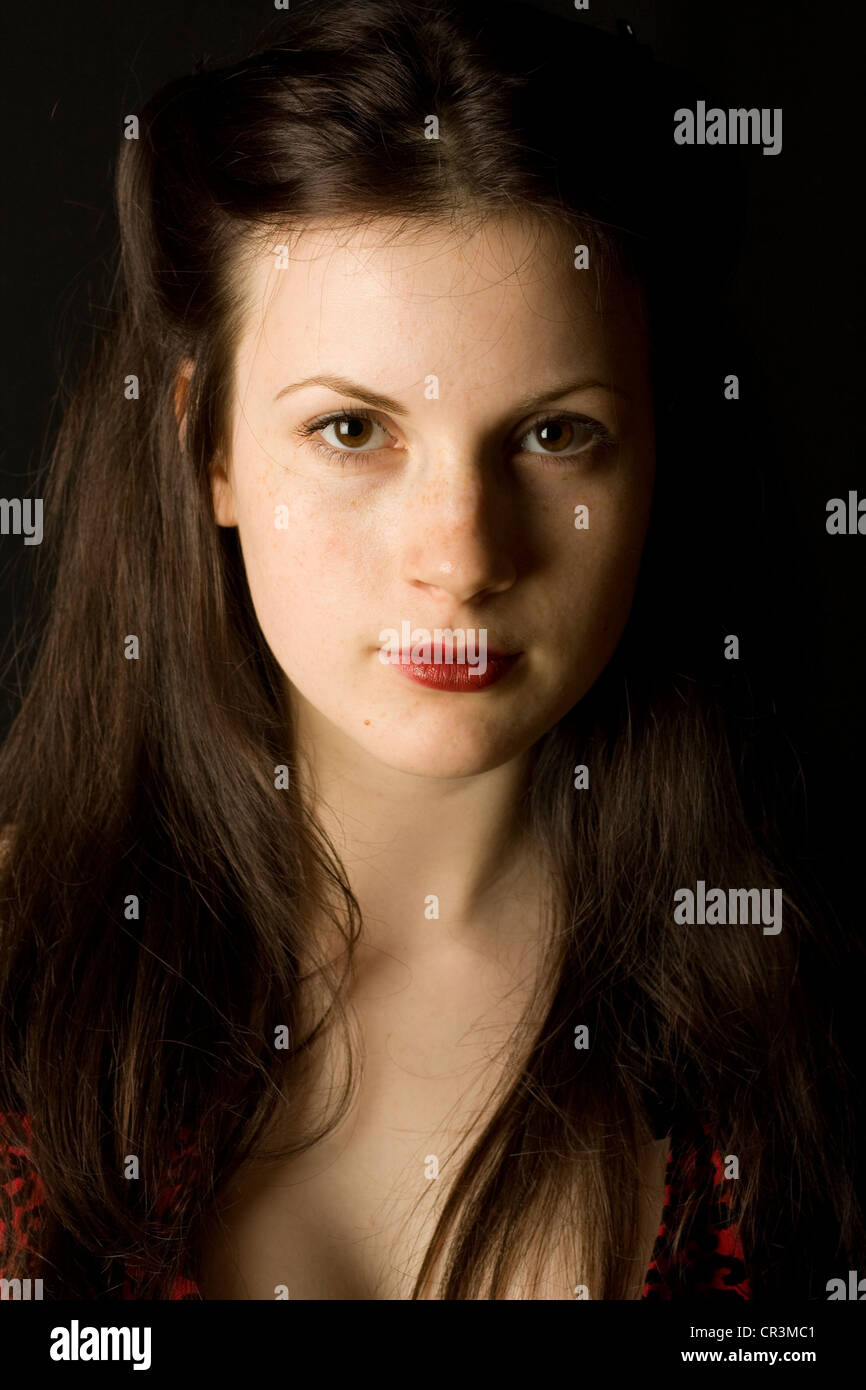 Woman with a serious face, portrait Stock Photo - Alamy