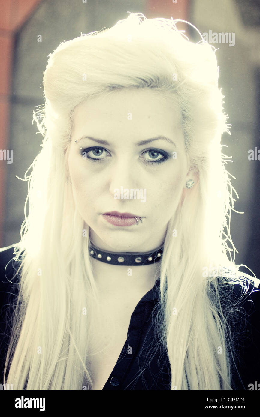 Woman with a serious face, punk, portrait Stock Photo - Alamy