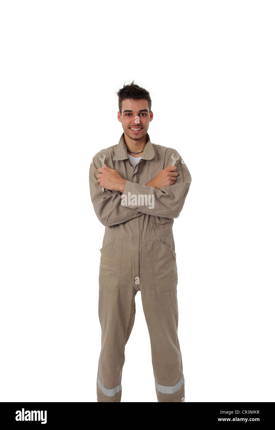 Young male artisan or workman standing in fresh clean overalls with his ...