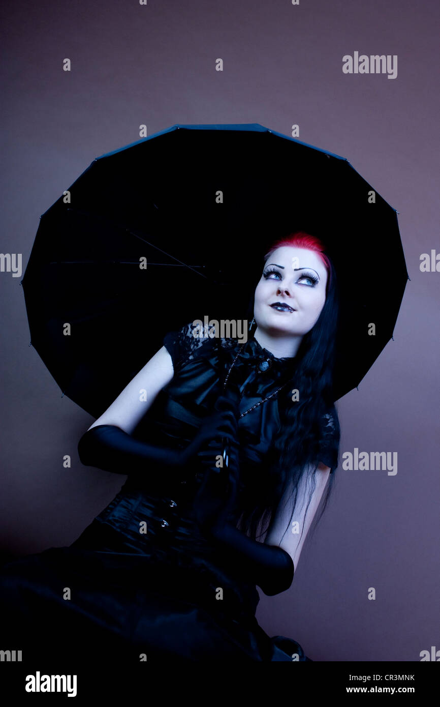 Woman, Gothic, umbrella, sitting Stock Photo - Alamy