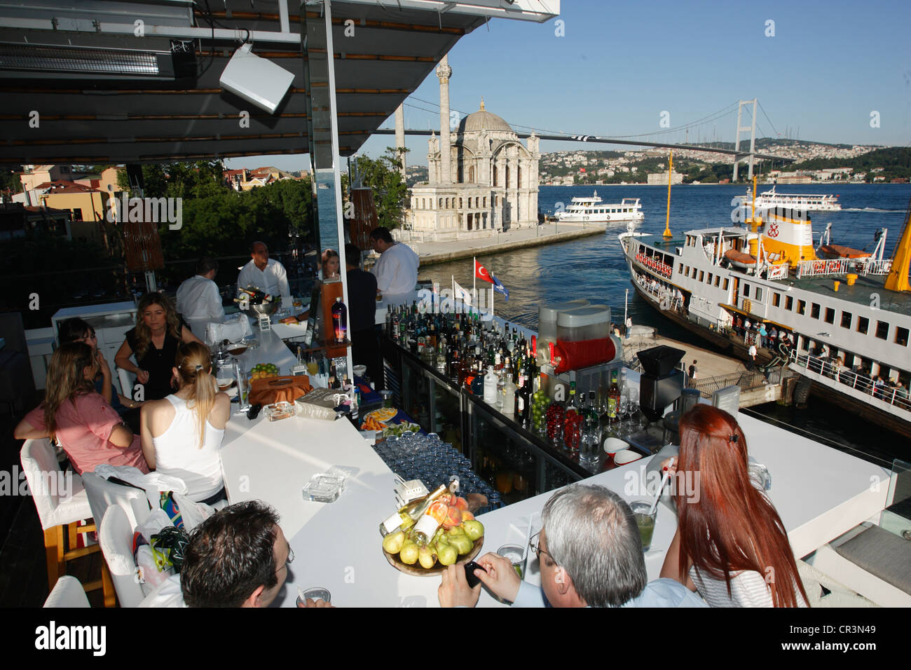 Turkey, Istanbul, bar on Bosphorus banks, Ortakoy Mosque and Bosphorus ...