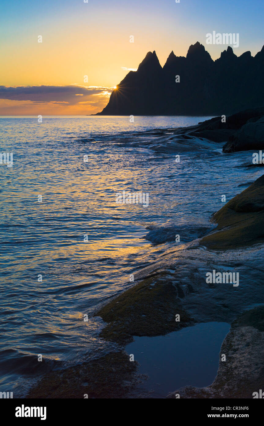 Coastline, Okshornan mountains in midsummer sunset, Senja island ...